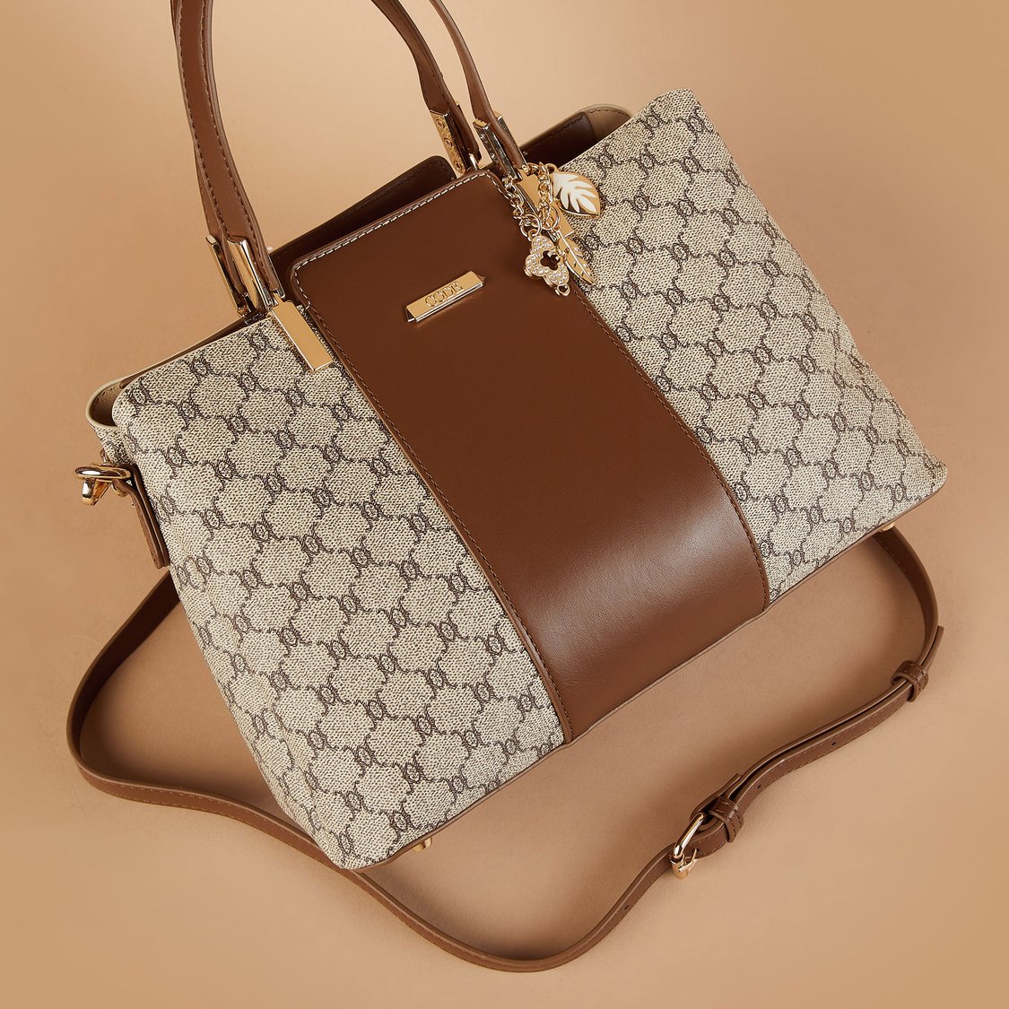 Buy CODE Monogram Print Handheld Bag from CODE at just INR 2299.0