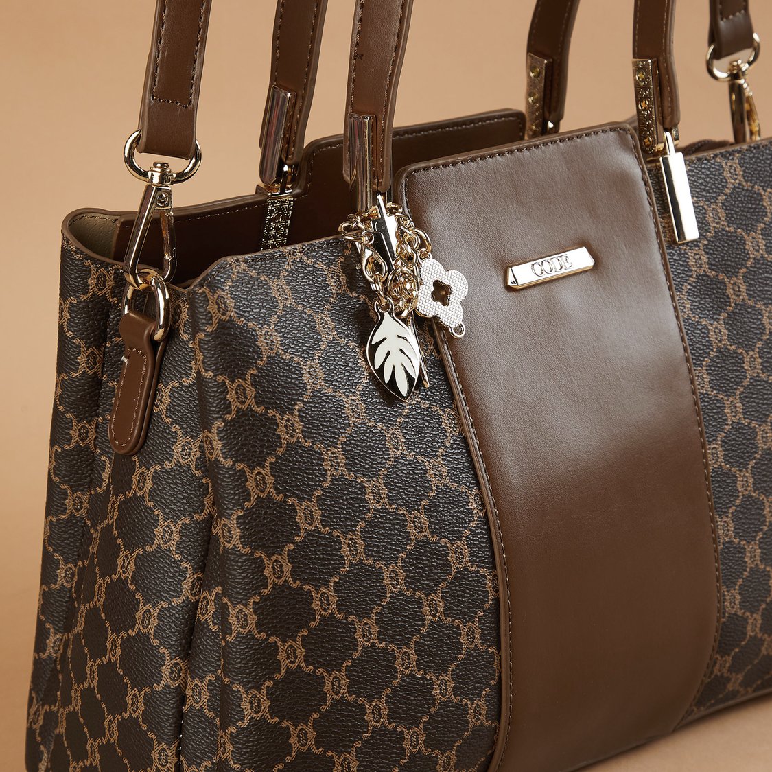 Buy CODE Monogram Print Handheld Bag from CODE at just INR 2299.0