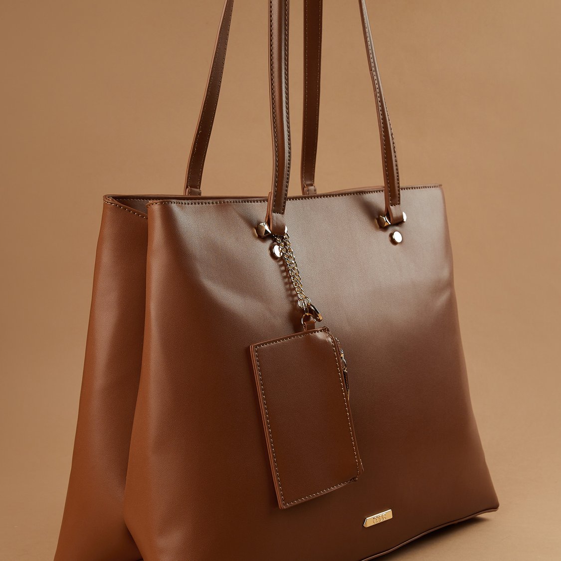 Buy CODE Solid Shoulder Bag with Pouch from CODE at just INR 2699.0