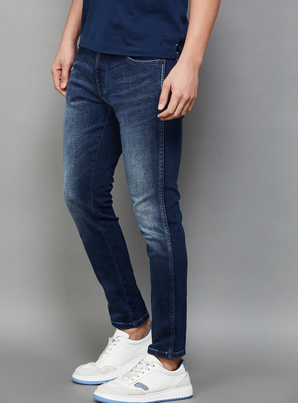 Buy WRANGLER Whiskered Slim Straight Jeans from Wrangler at just INR 3999.0