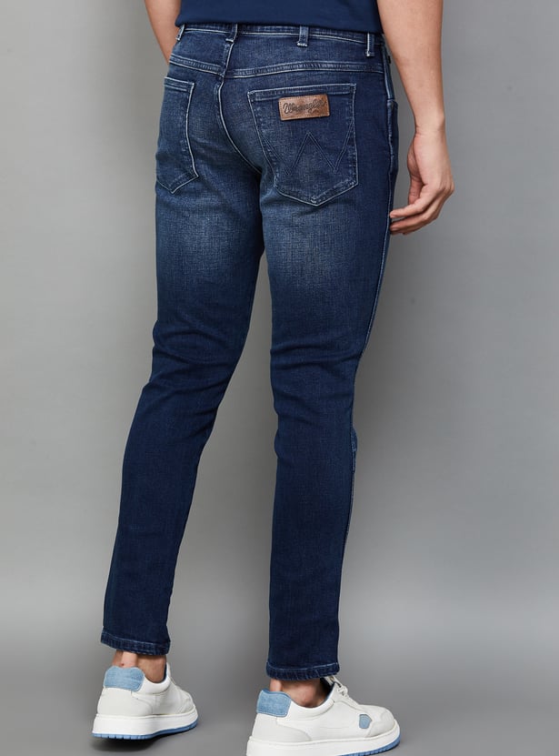 Buy WRANGLER Whiskered Slim Straight Jeans from Wrangler at just INR 3999.0